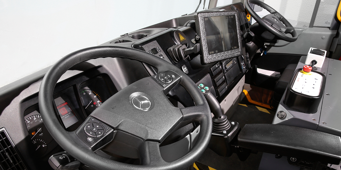 Econic with steering wheels and controls on both sides of the cabin.
