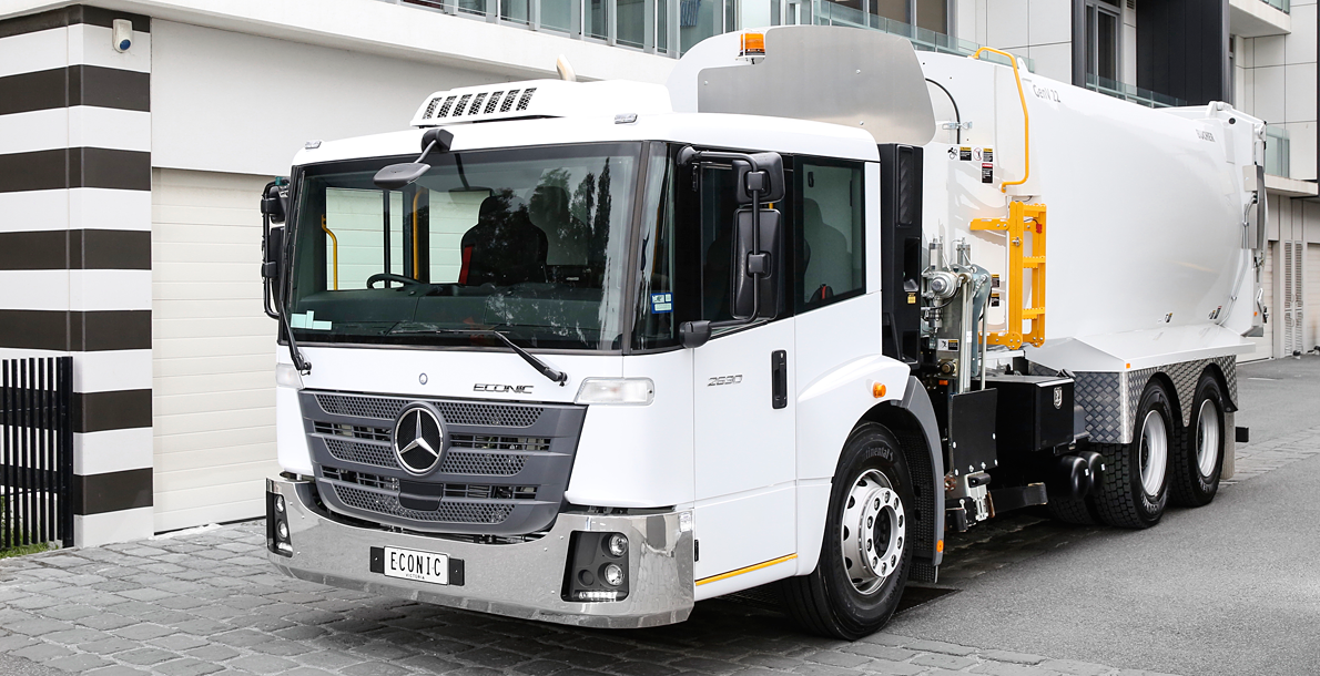 Econic with steering wheels and controls on both sides of the cabin.